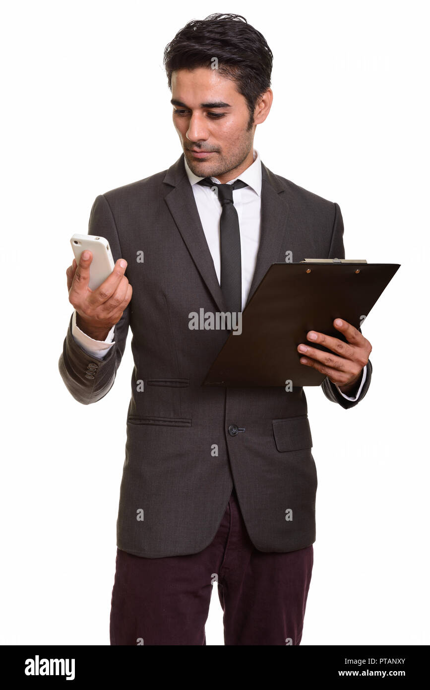 Young handsome Persian man against white background Stock Photo - Alamy