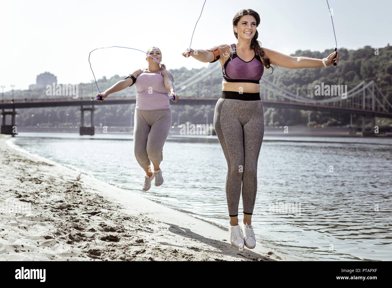 Joyful happy women doing useful sports activities Stock Photo - Alamy