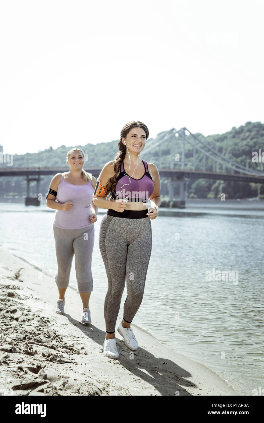 Happy active young women leading healthy lifestyle Stock Photo - Alamy