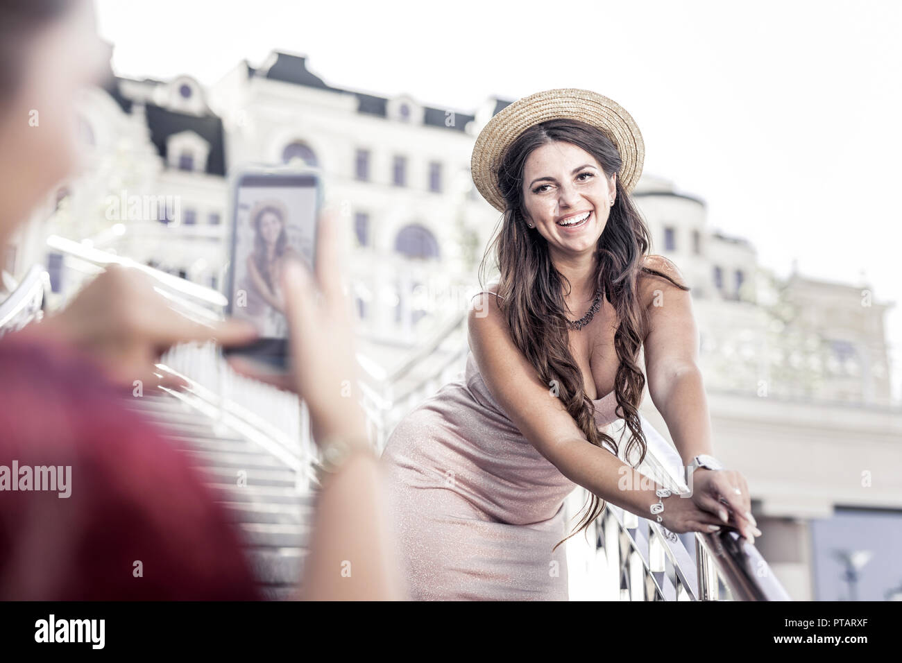 Happy positive woman posing for a photo Stock Photo - Alamy
