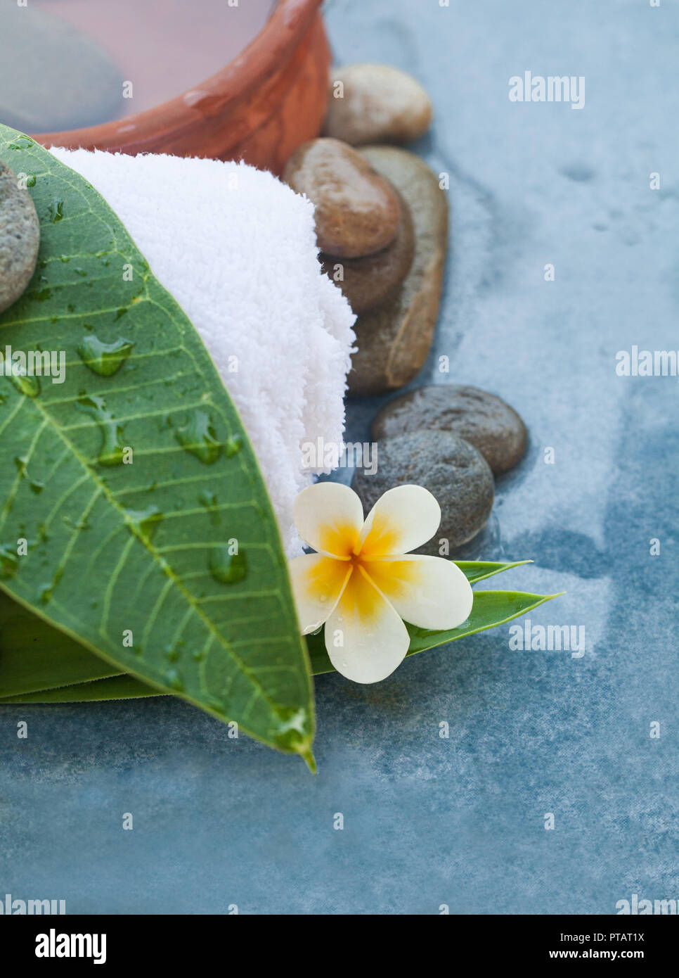 Objects and stones for relax and spa massage treatment on blue ...