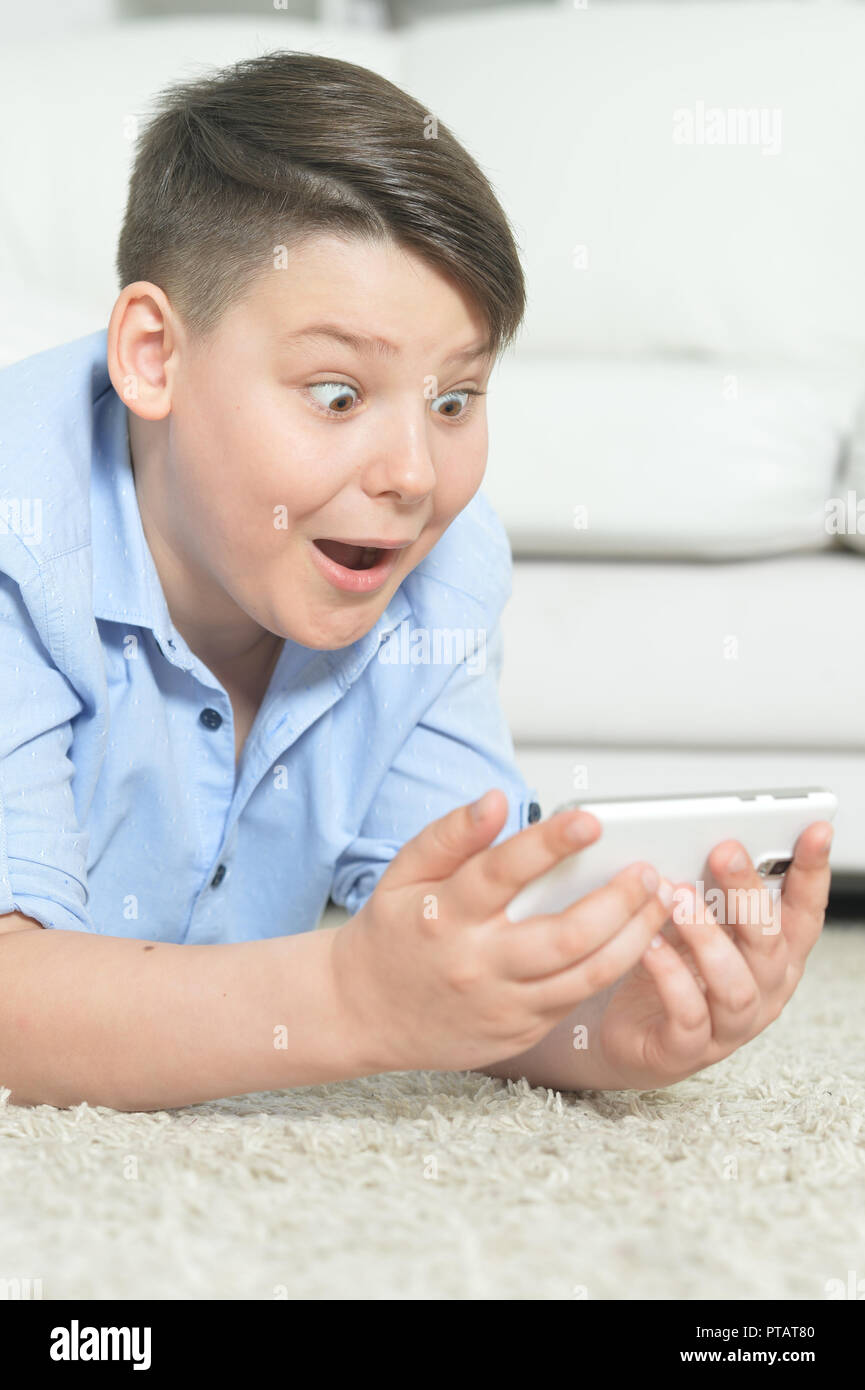 Portrait of a young boy with smartphone Stock Photo - Alamy