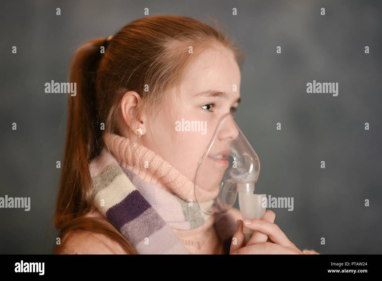 Portrait of a sick girl with inhaler fell ill cold Stock Photo - Alamy