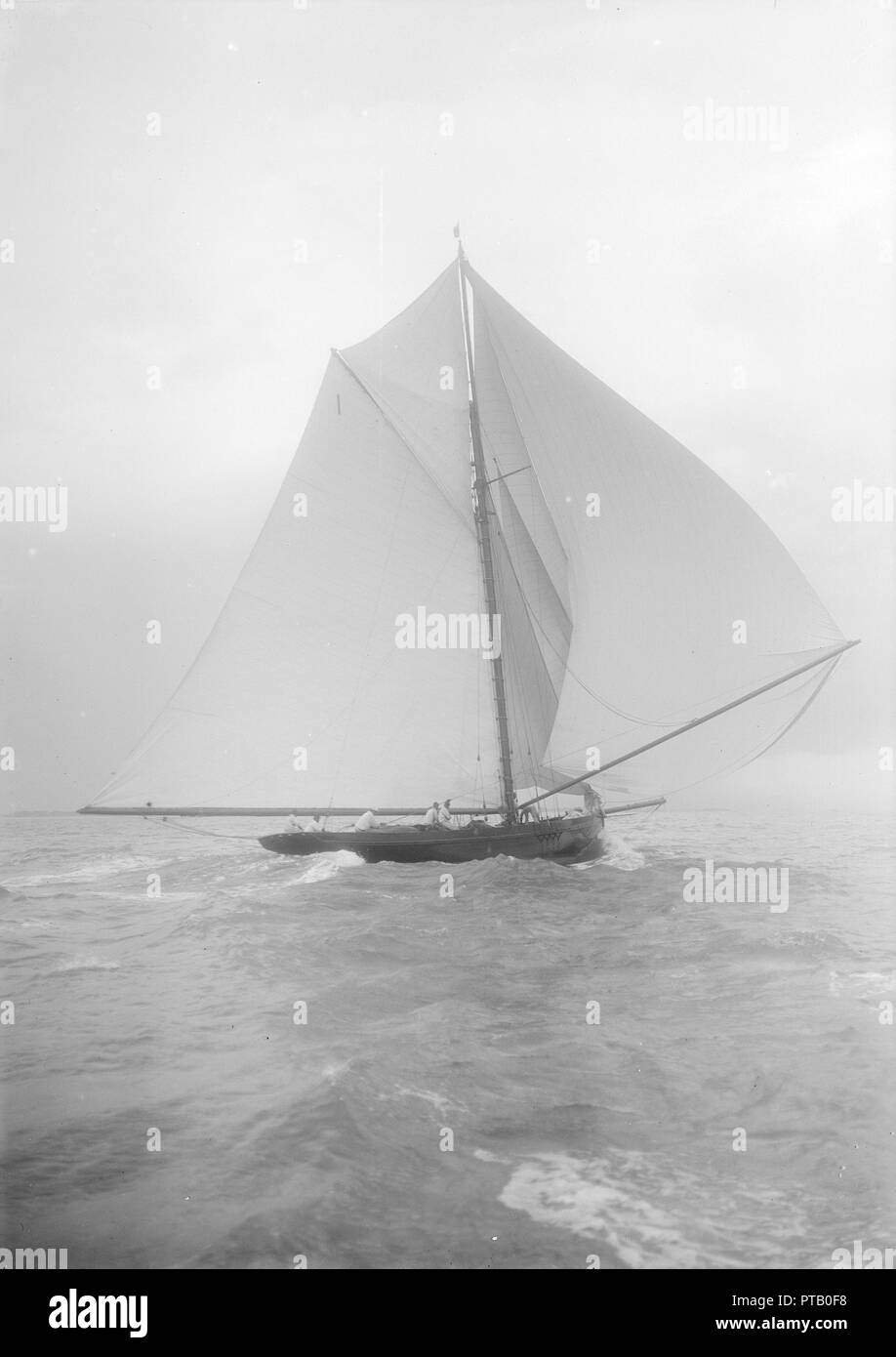 The gaff rigged cutter 'Bloodhound' sailing downwind under spinnaker ...