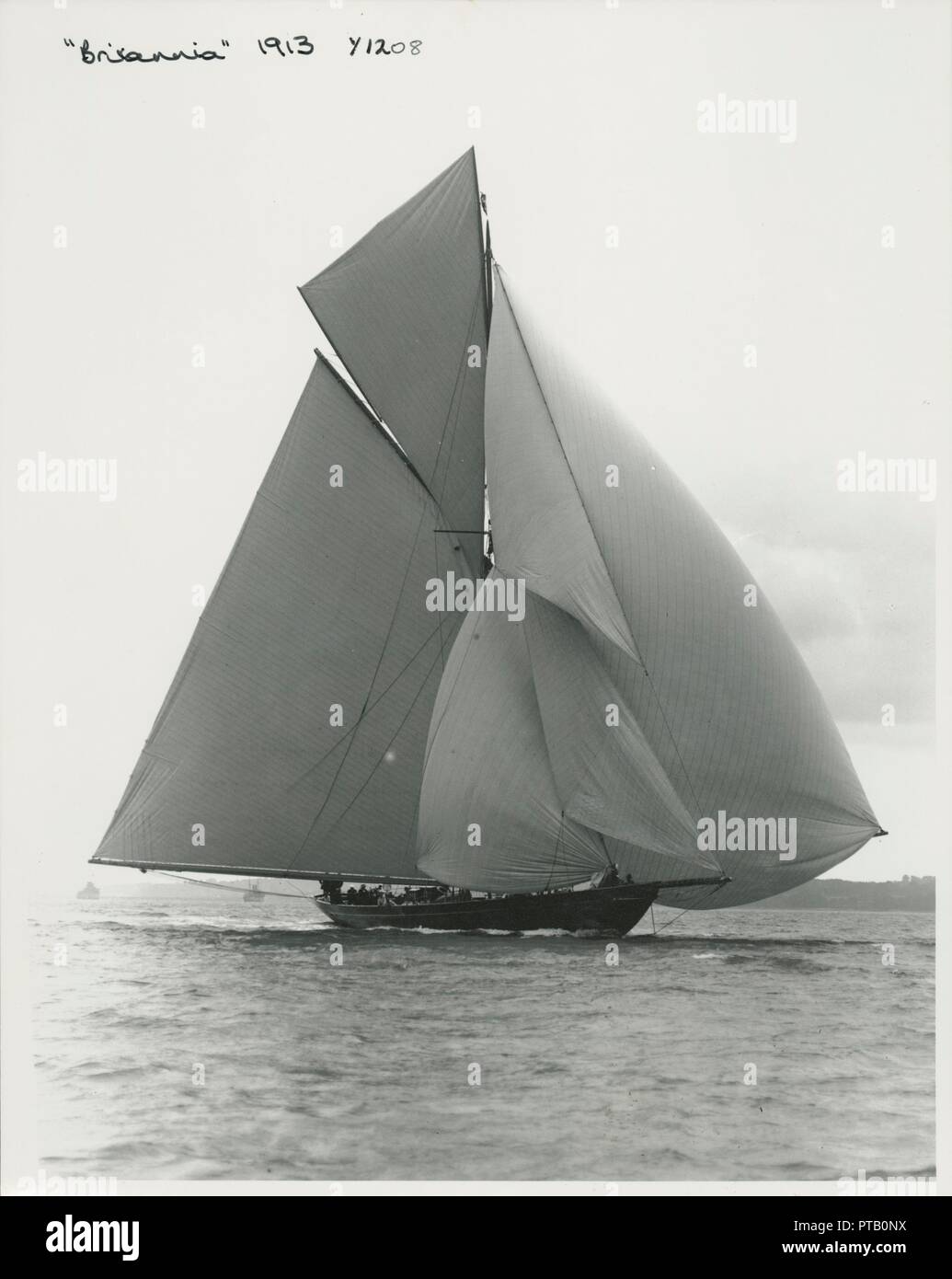 The 221 ton gaff-rigged cutter 'Britannia' sailing under spinnaker ...
