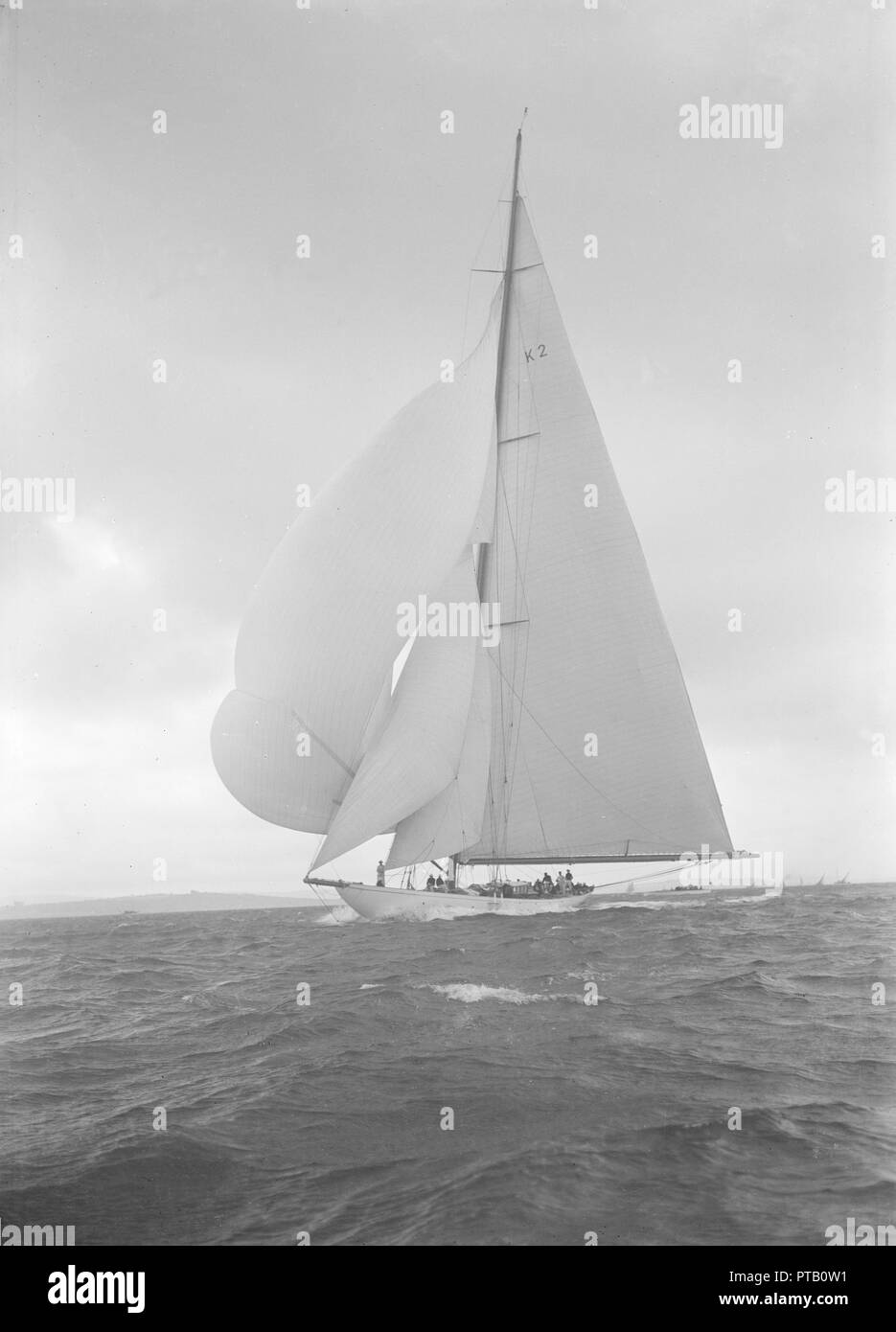 The 23-metre cutter 'Astra' sailing with spinnaker, 1932. Creator: Kirk ...