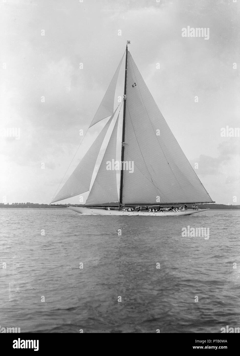 The 23-metre cutter 'Astra' sailing close-hauled. Creator: Kirk & Sons ...