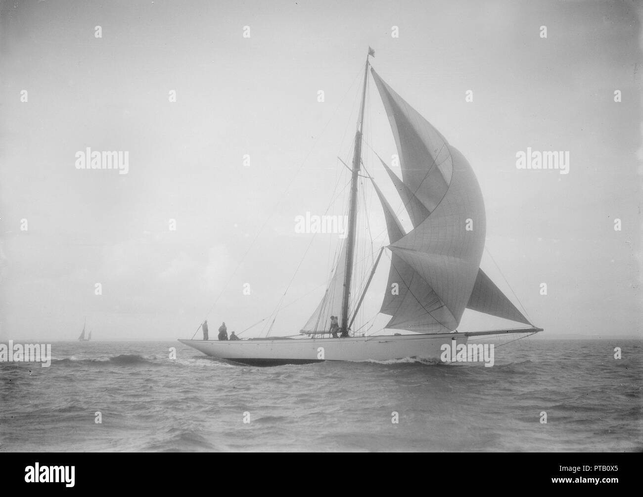 The cutter 'Westwind' sailing with spinnaker, 1912. Creator: Kirk ...