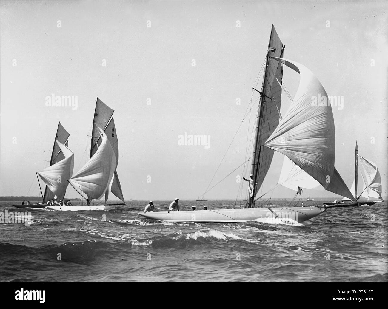 Group of 8 Metres sailing yachts racing downwind, 1911. Creator: Kirk ...