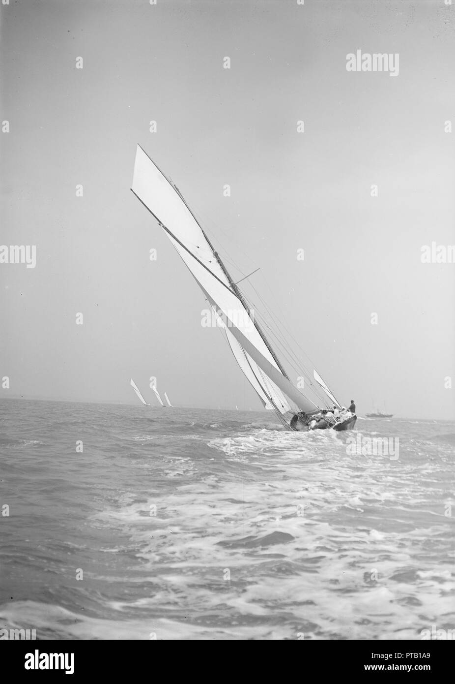 The gaff rigged cutter 'Bloodhound' sailing close-hauled, leaves wake ...