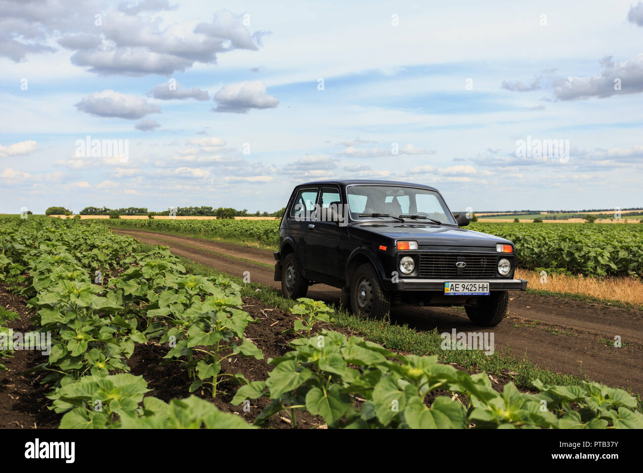 DNIPROPETROVSK REGION, UKRAINE - JULY 08, 2017: Vaz Niva blue-green ...