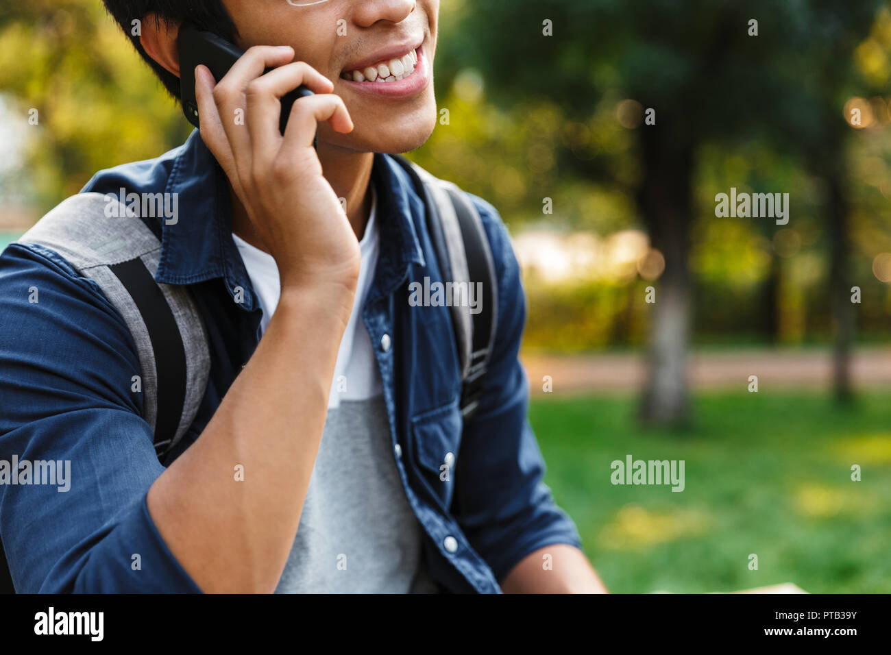 Asian male teen phone hi-res stock photography and images - Alamy