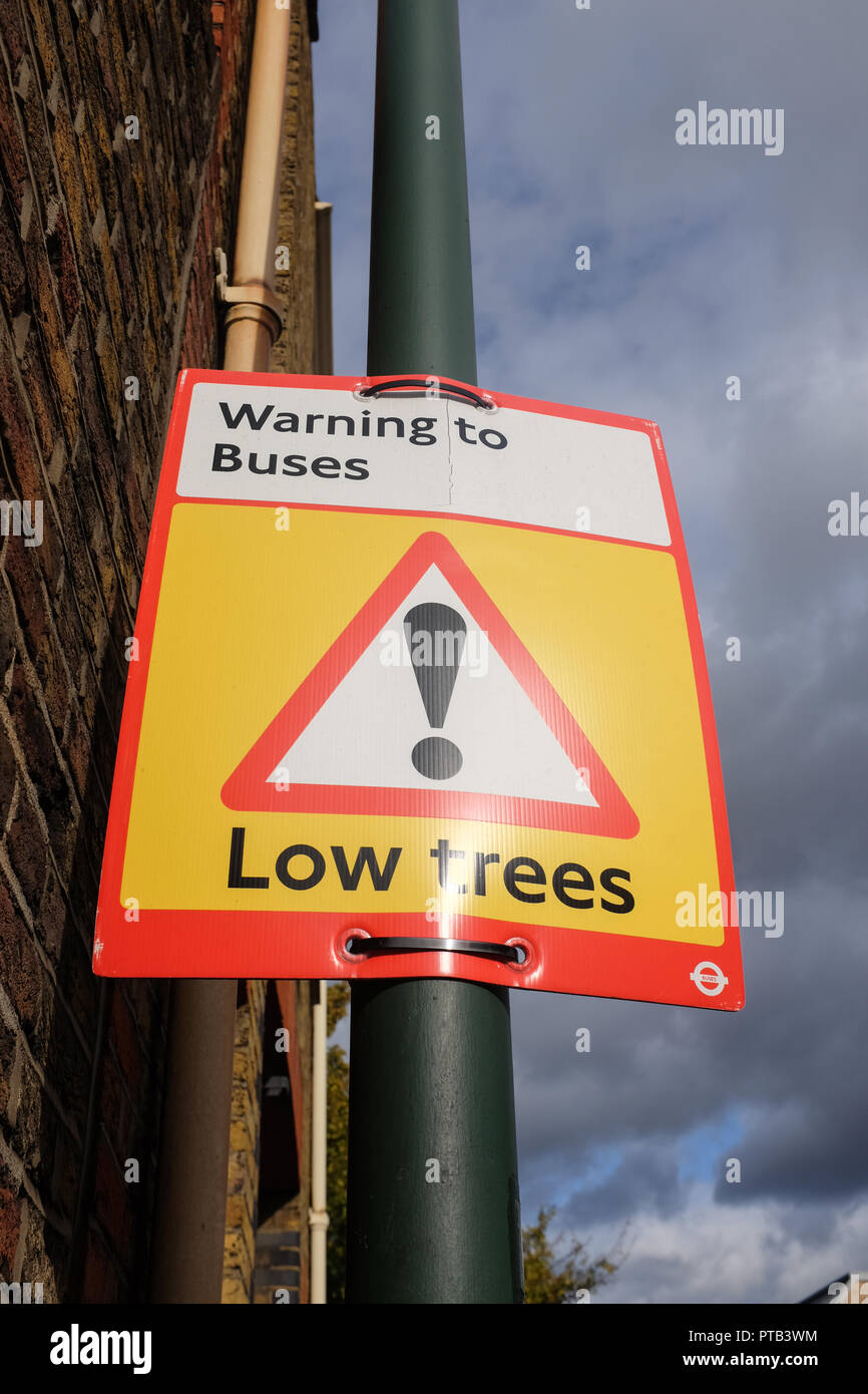 Low Trees warning sign for buses at Barnes Mortlake London UK Stock ...