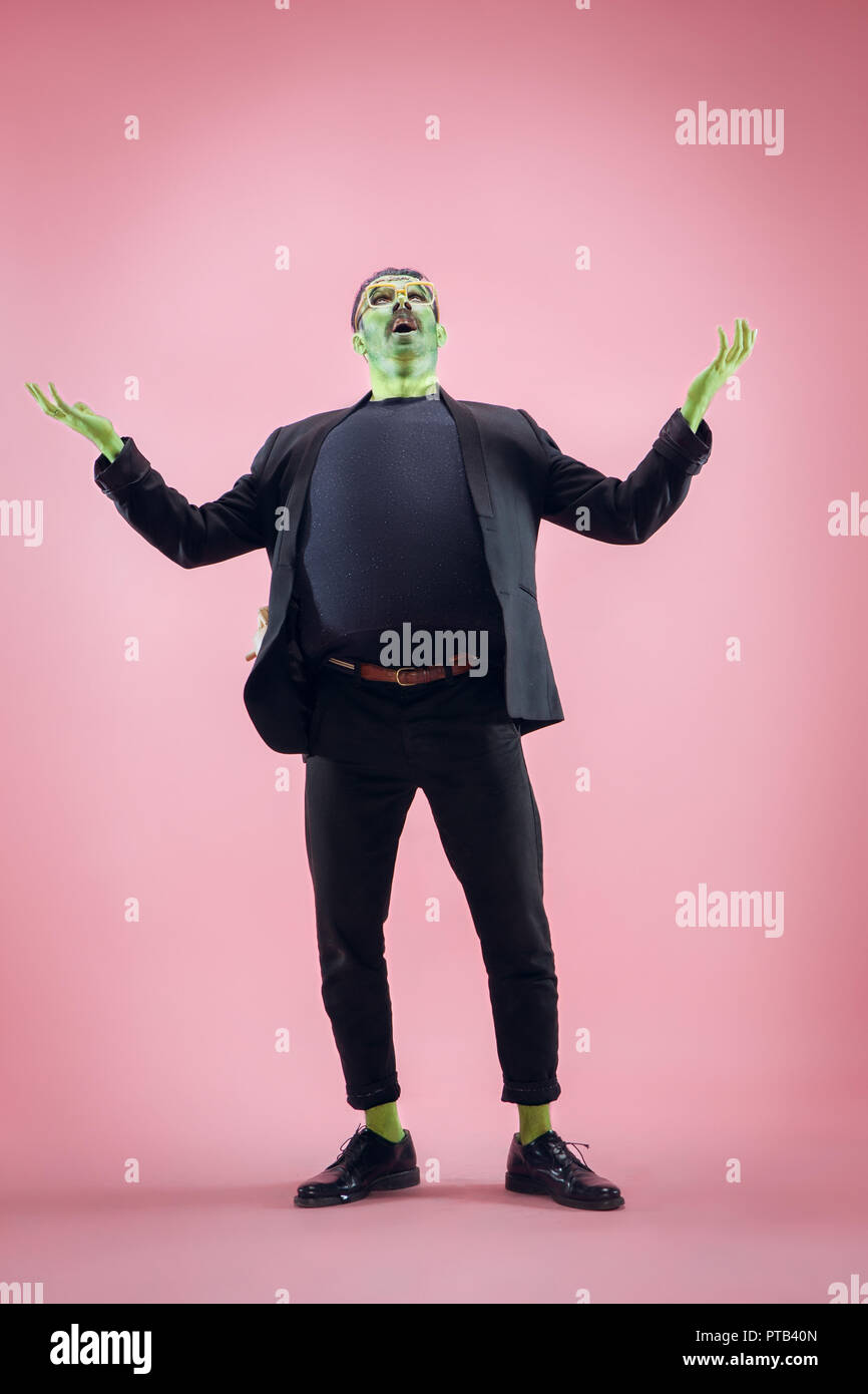 Bloody Halloween theme: The crazy maniak face on pink studio background ...