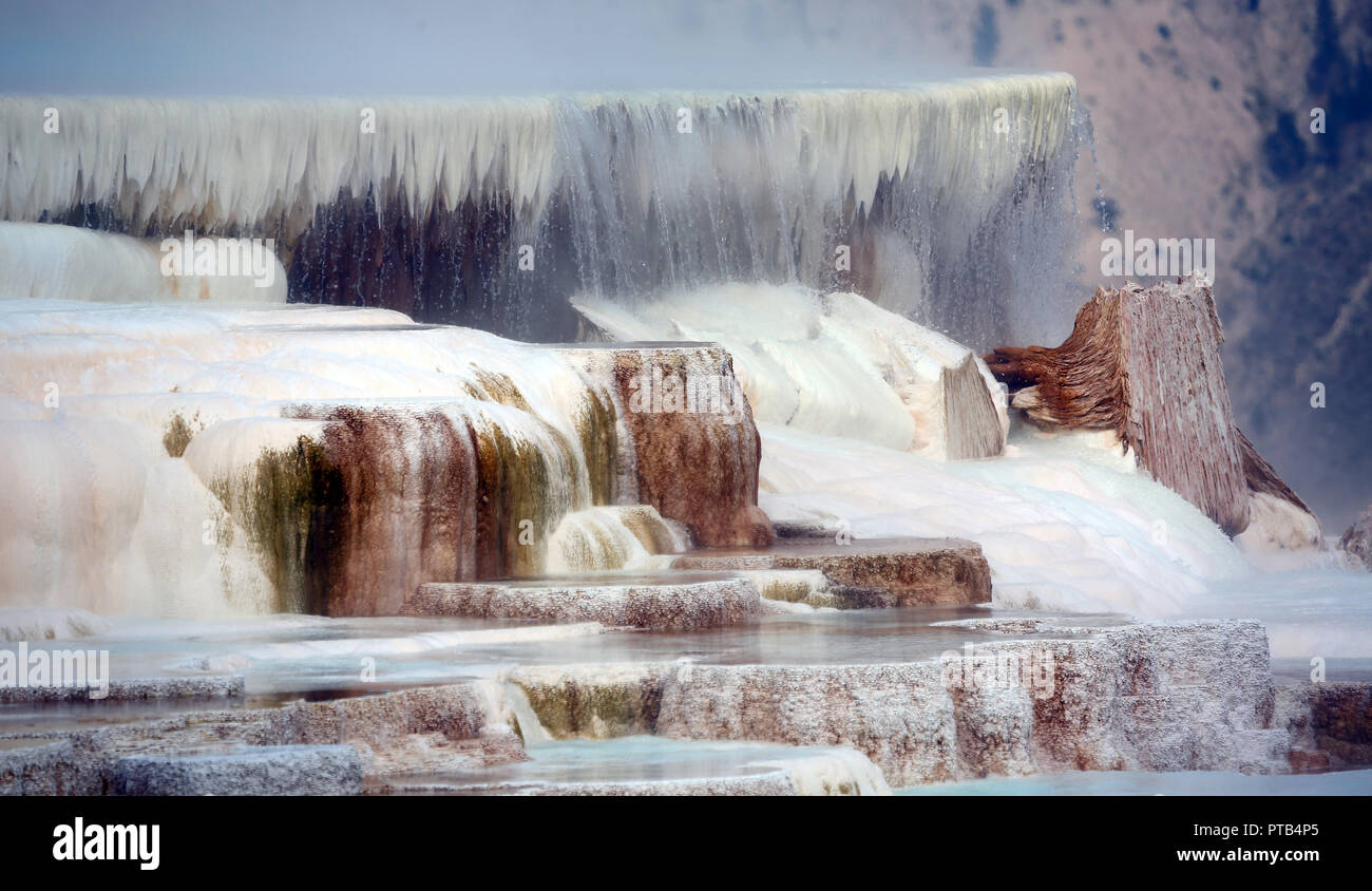 active hot spring with hot flowing water creating falls and flowstone ...