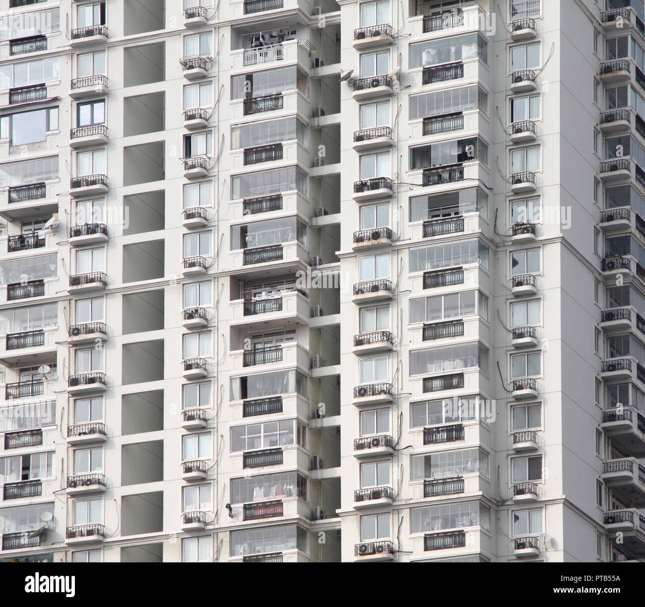 Facade of modern residential high rise building with lots of windows ...