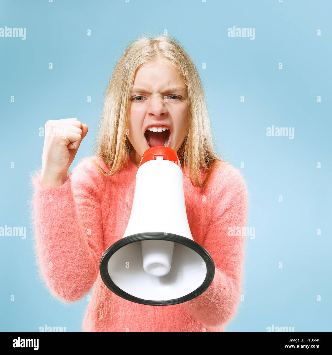 Cute teen girl holding speaker hi-res stock photography and images - Alamy