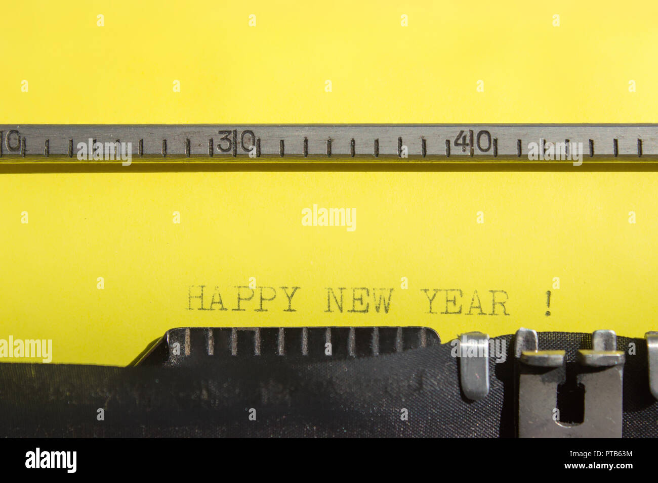 Old typewriter with yellow paper with text Happy New Year Stock Photo ...