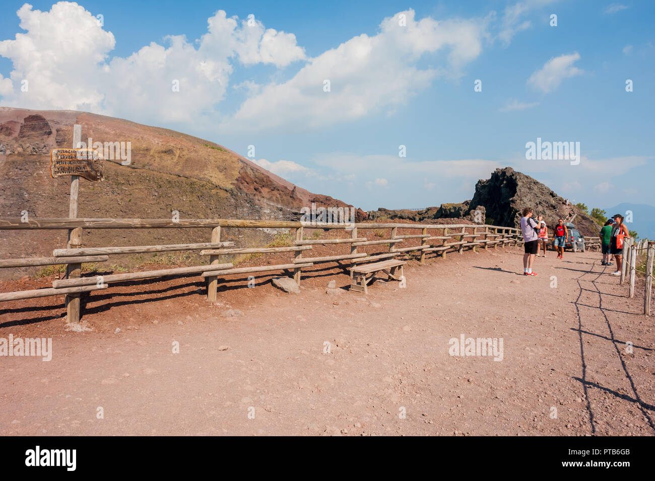 MOUNT VESUVIUS, ITALY - AUGUST 1, 2018: Tourists walk around the crater ...
