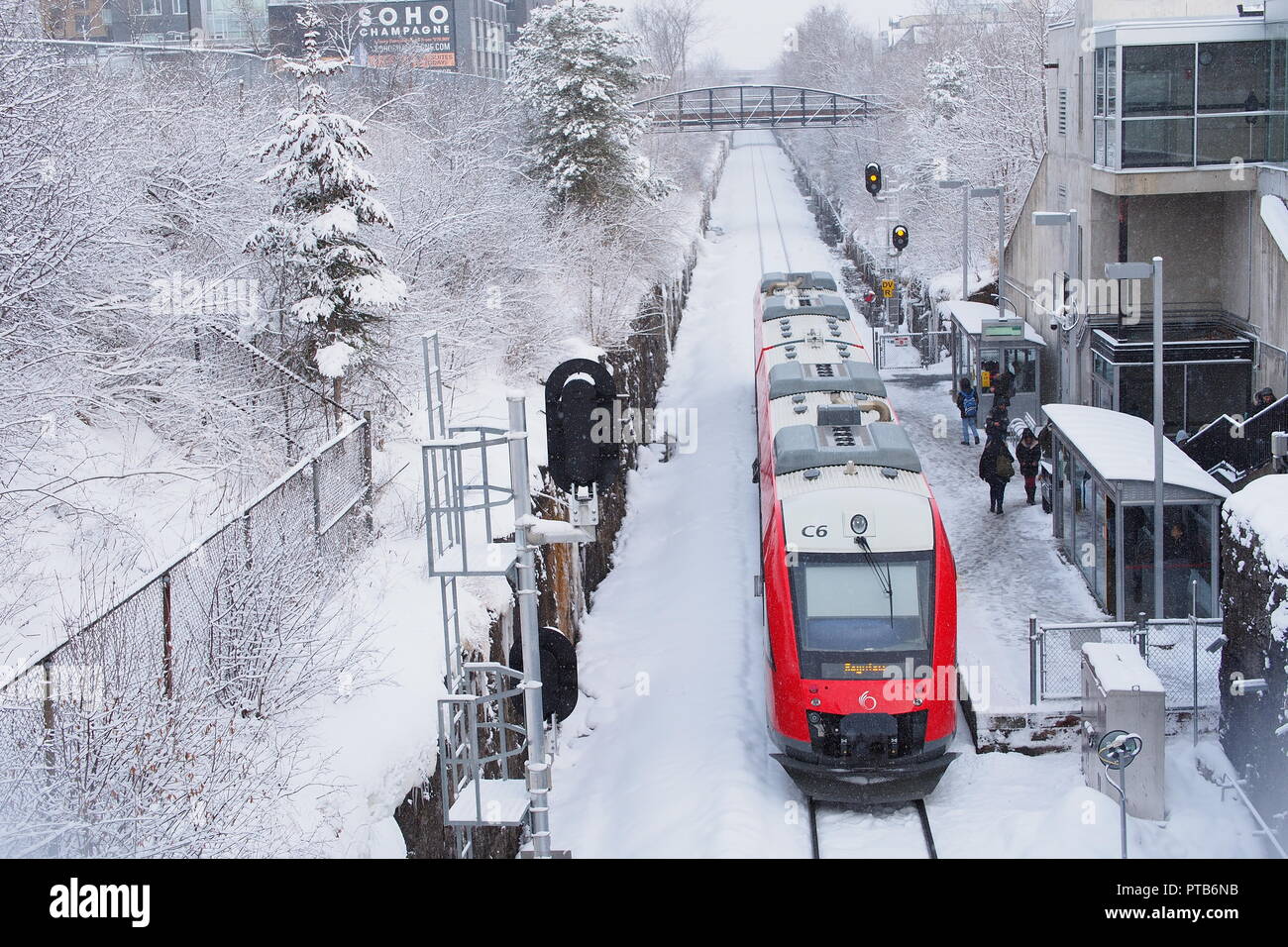 Southbound OC Transpo O-train at the Carling stop on a very snowy ...