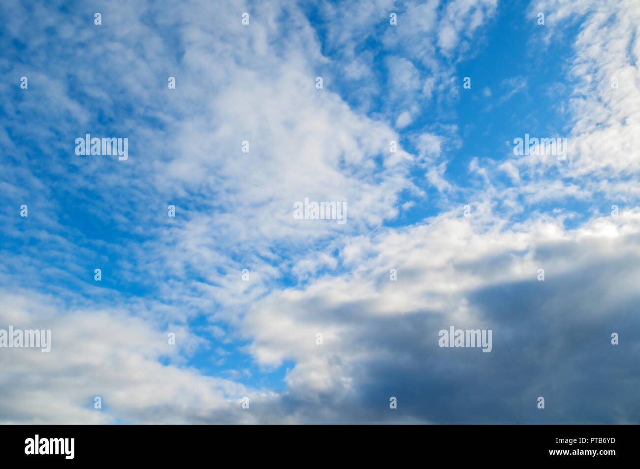 Blue sky landscape scene with fluffy dramatic colorful clouds and ...