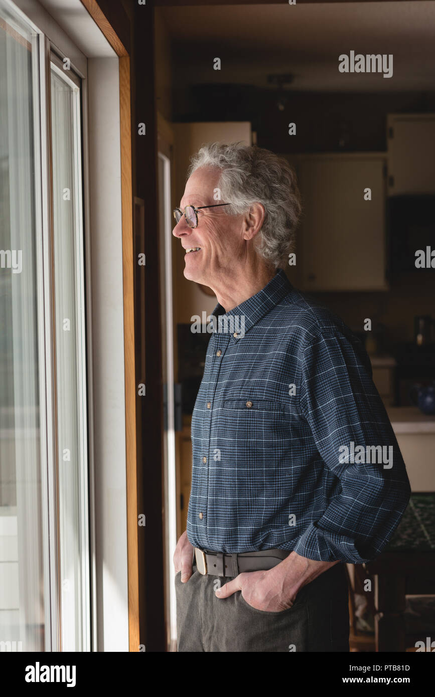 Man looking through window hands hi-res stock photography and images ...