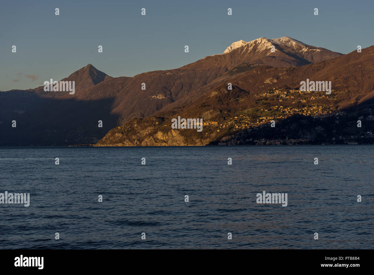 Europe, Italy, Lecco, Lake Como, a large body of water with a mountain ...