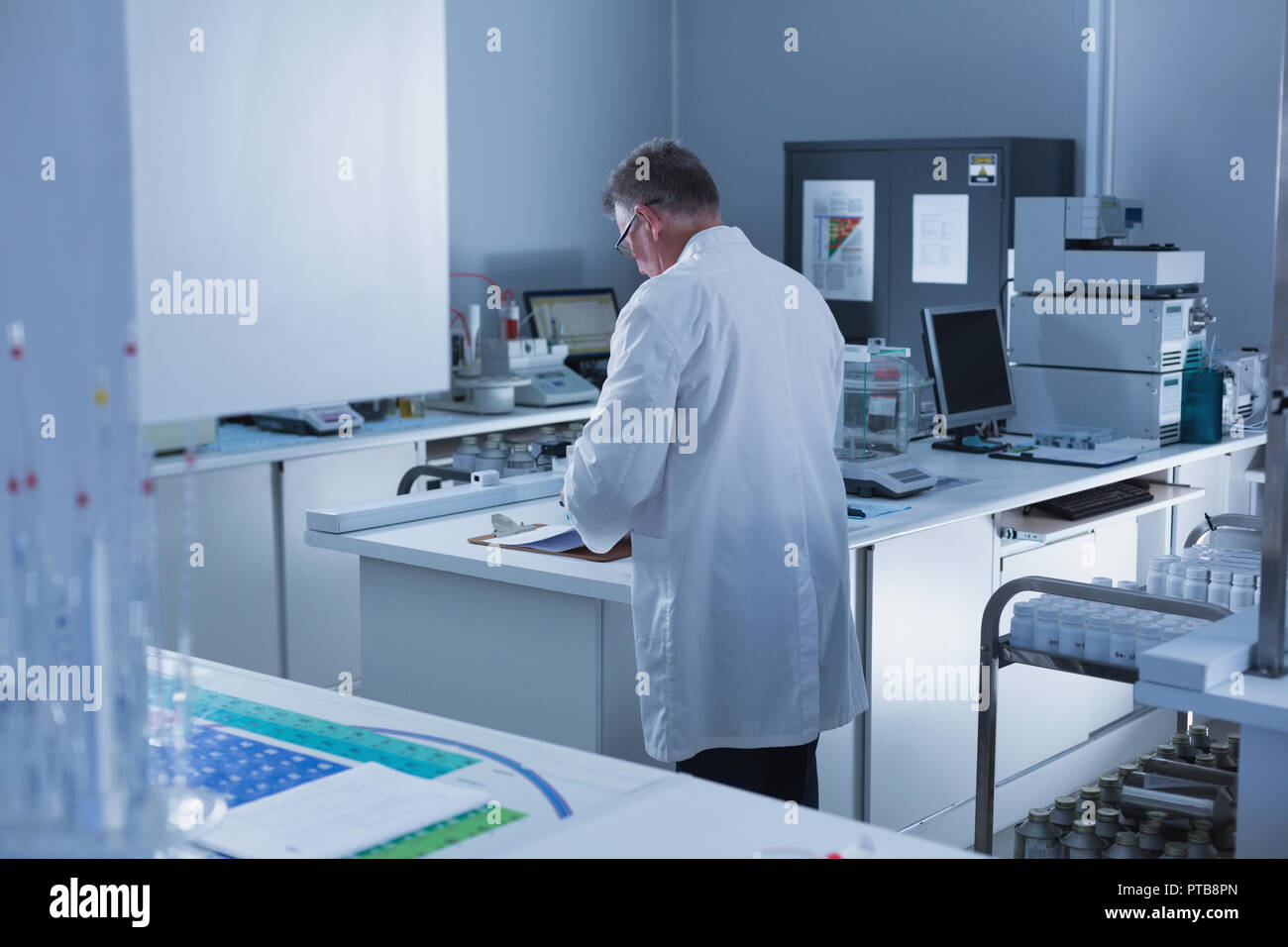 Male scientist experimenting in laboratory Stock Photo - Alamy