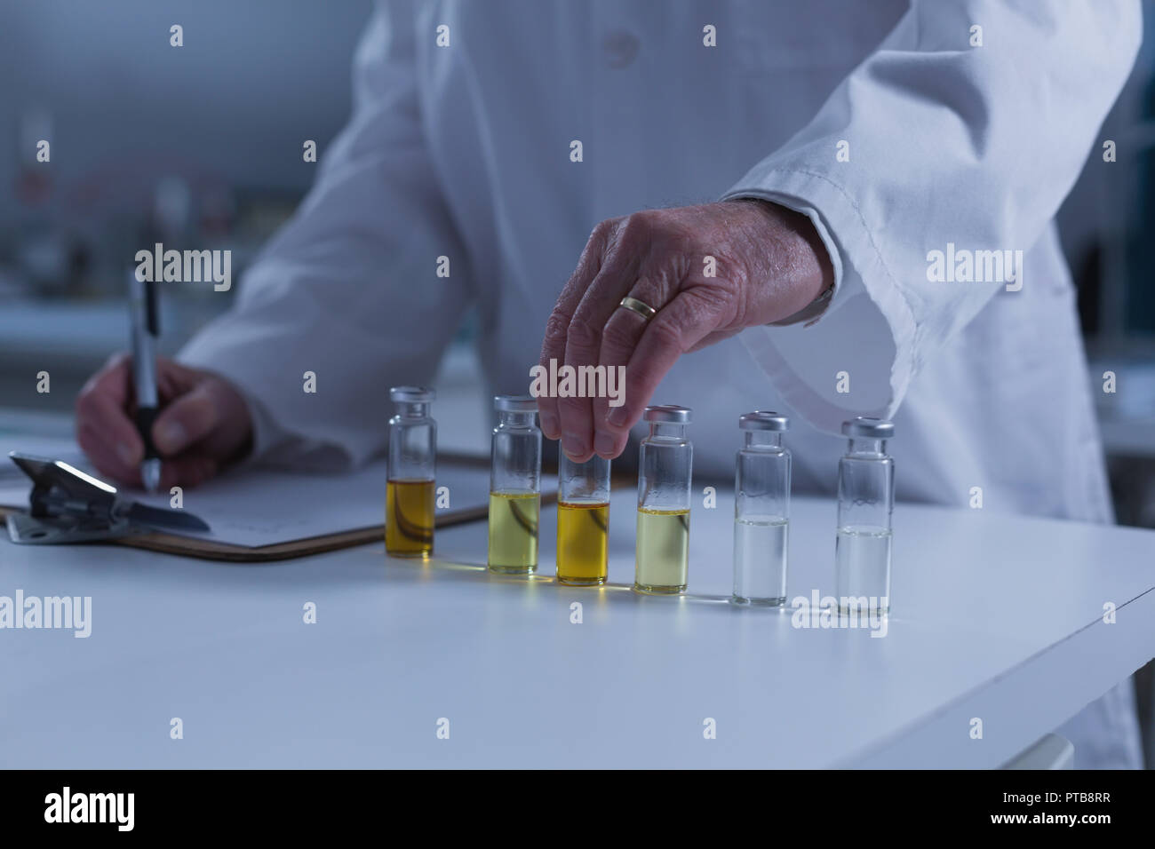 Male scientist experimenting in laboratory 4k Stock Photo - Alamy