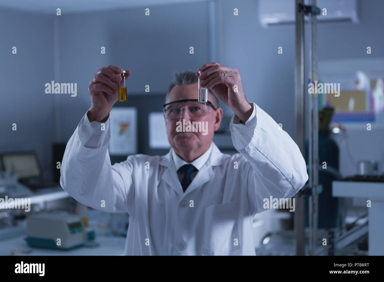 Male scientist experimenting in laboratory Stock Photo - Alamy