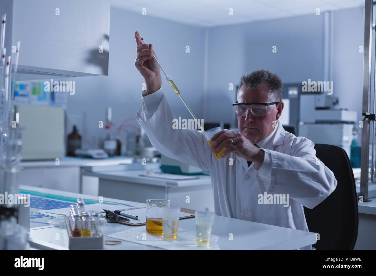 Male scientist experimenting in laboratory Stock Photo - Alamy