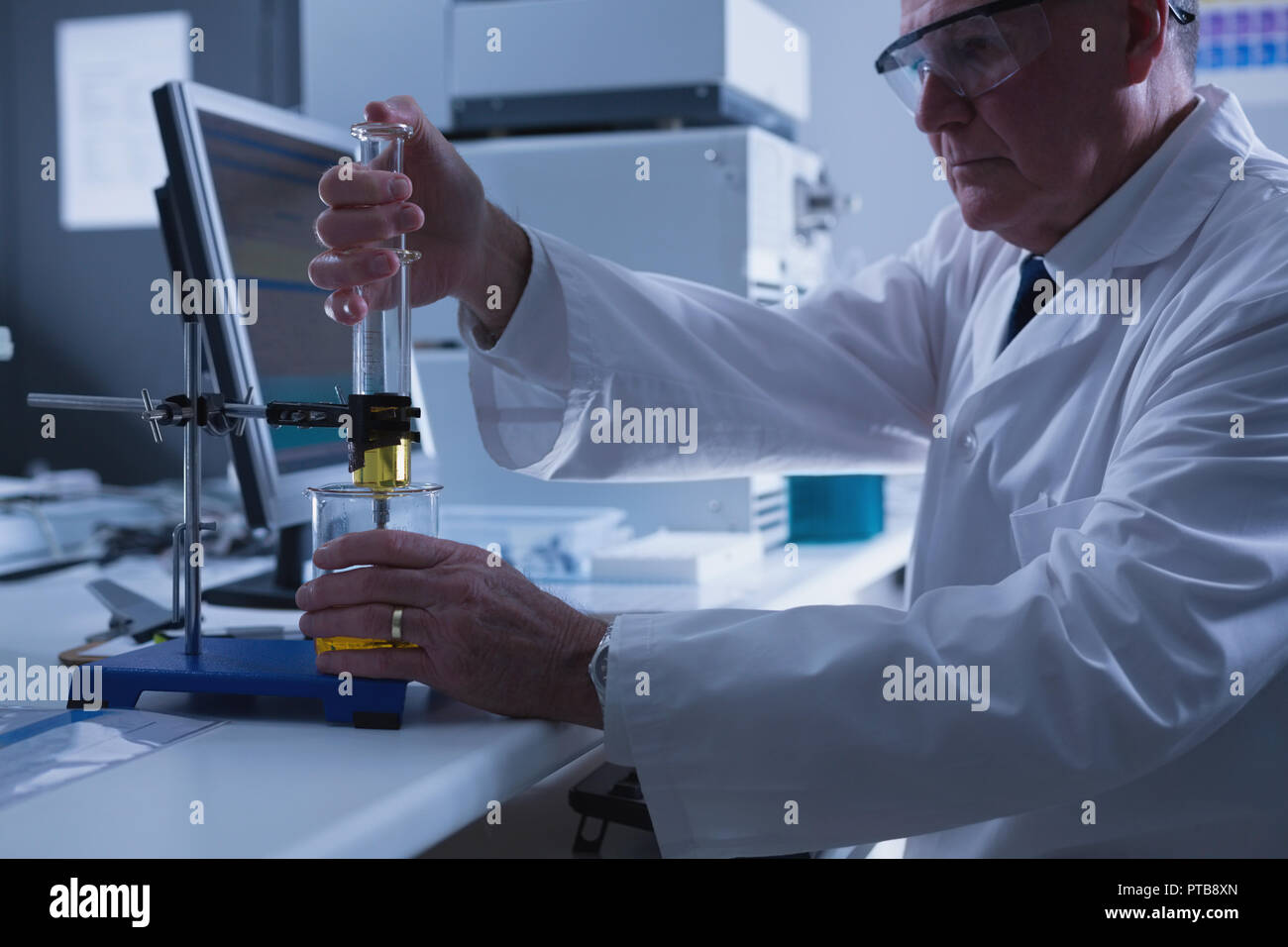 Laboratory scientist holding tube flask hi-res stock photography and ...