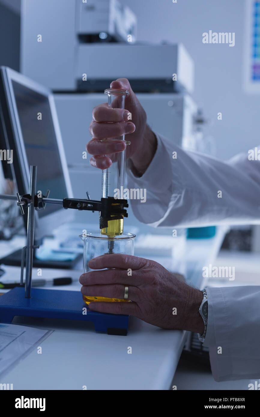 Male scientist experimenting in laboratory Stock Photo - Alamy