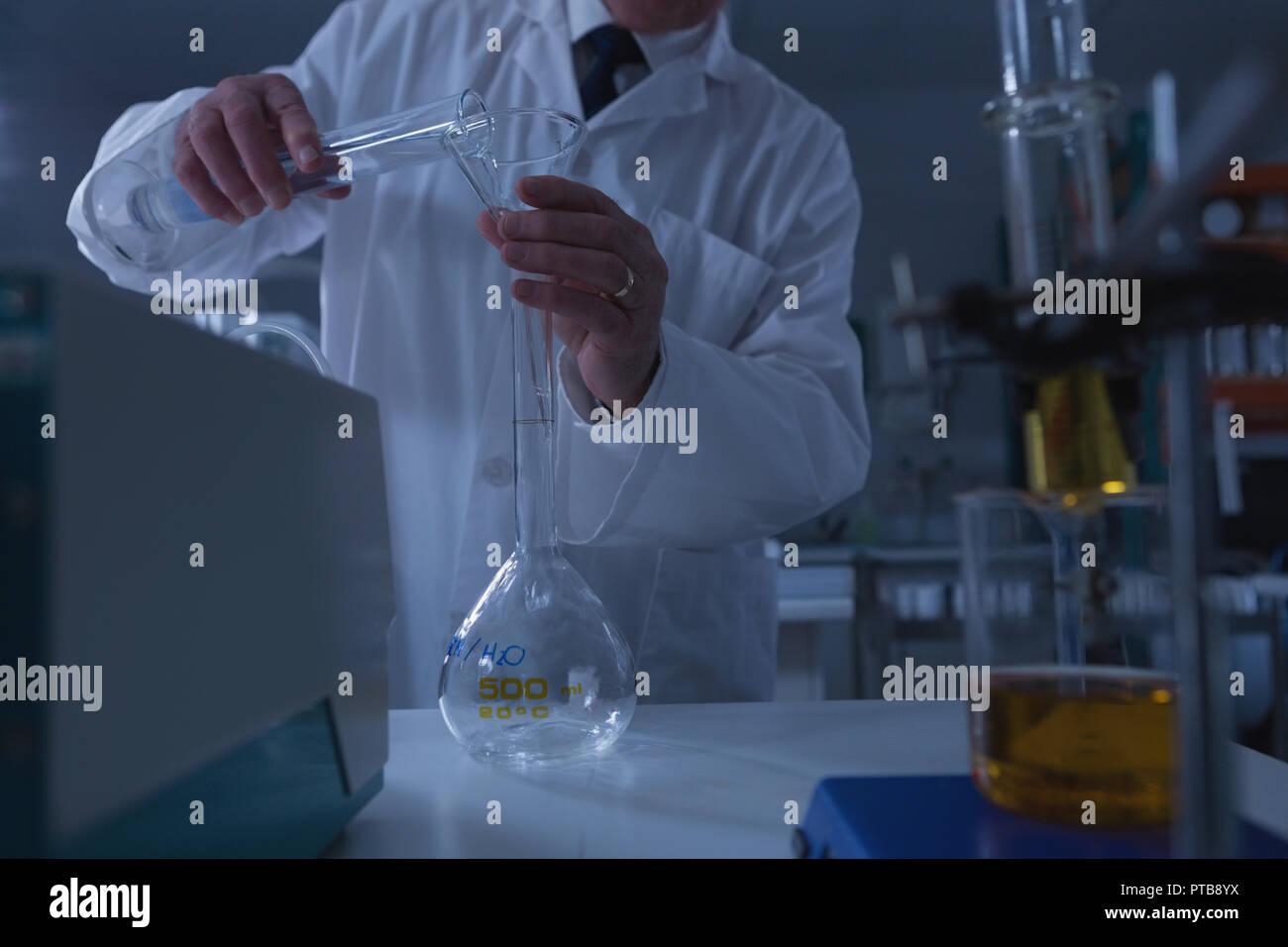 Male scientist experimenting in laboratory Stock Photo - Alamy