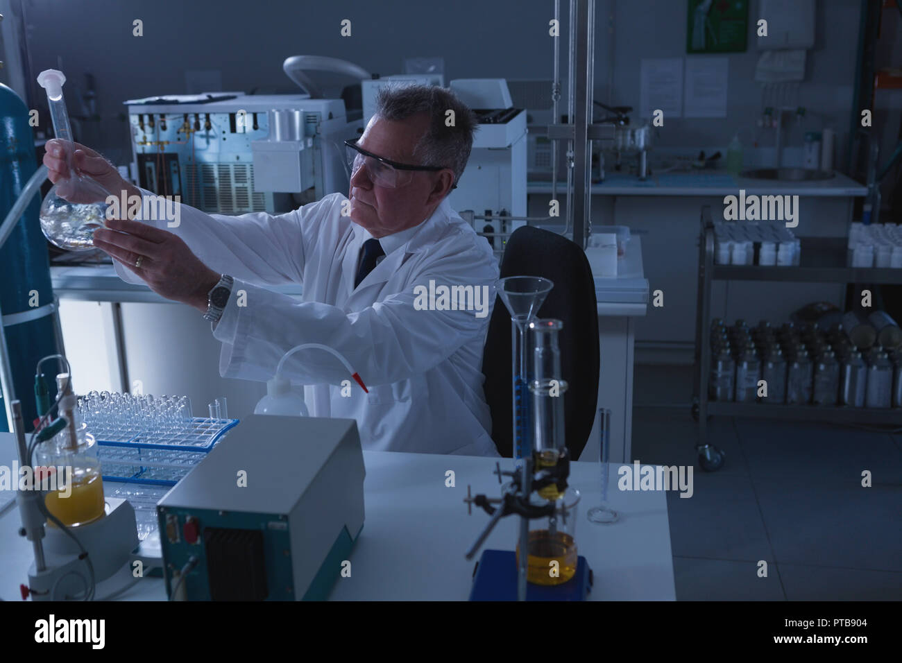 Male scientist experimenting in laboratory Stock Photo - Alamy