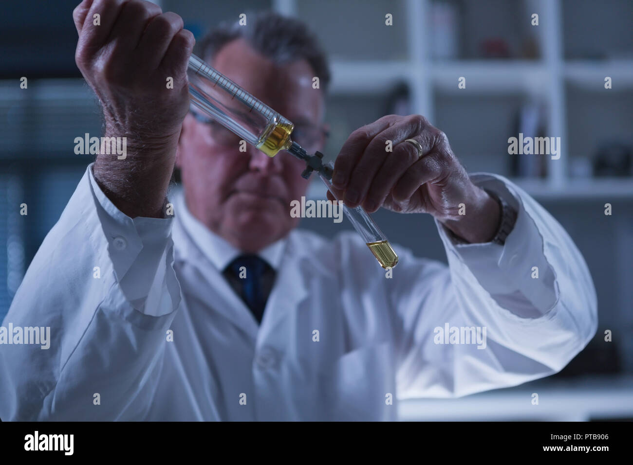 Male scientist experimenting in laboratory Stock Photo - Alamy