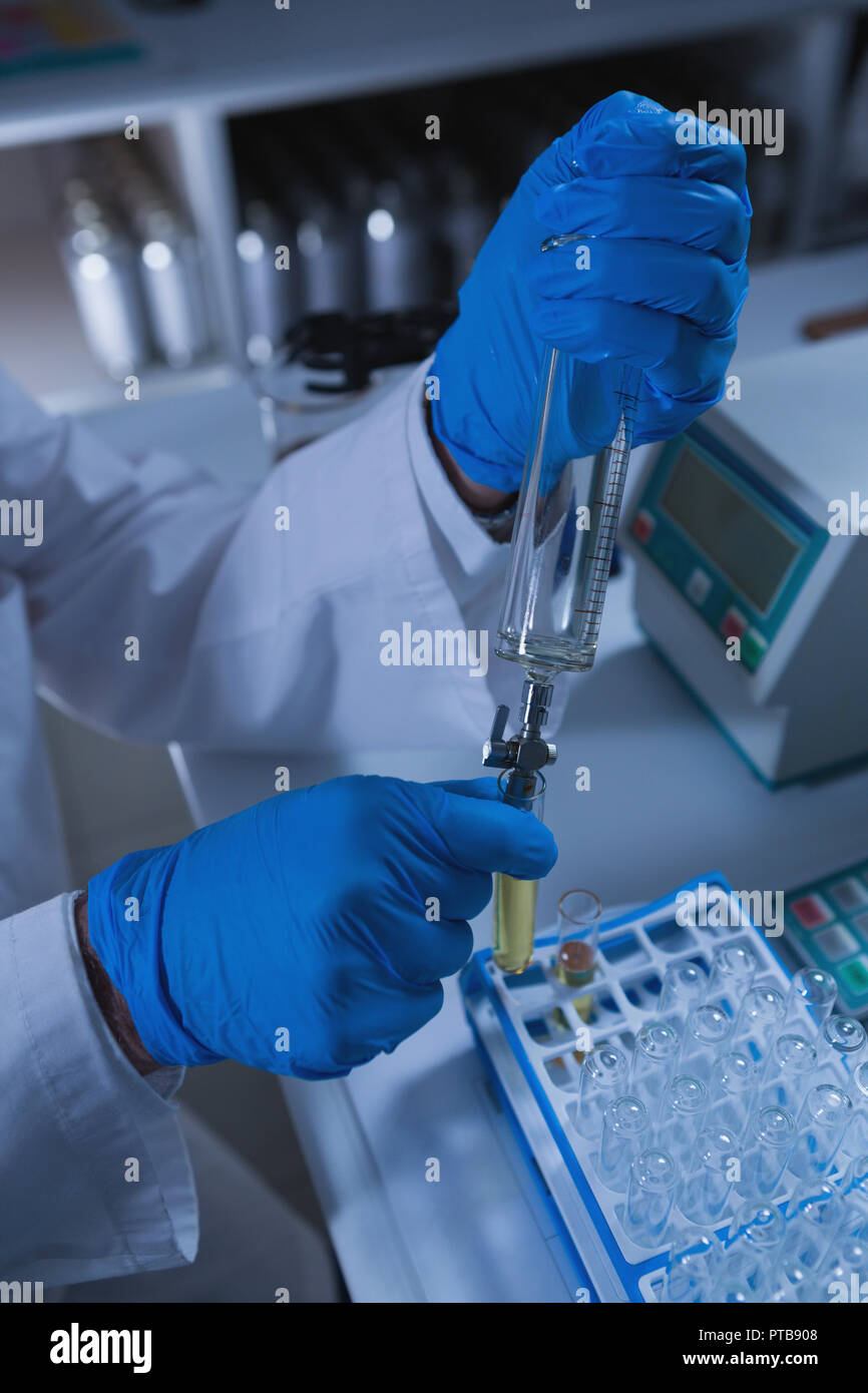Male scientist experimenting in laboratory Stock Photo - Alamy