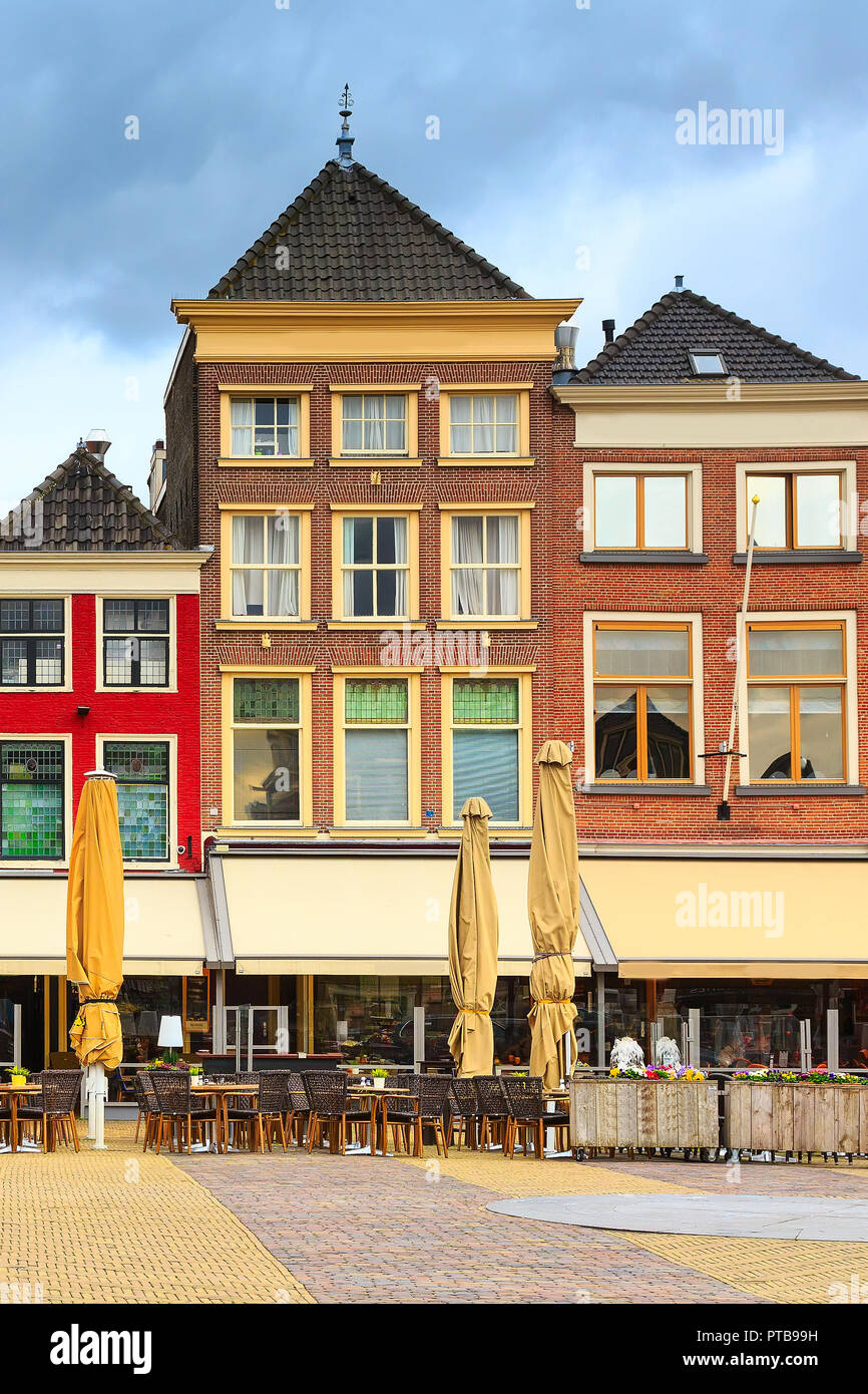 Delft, Holland colorful street view with traditional dutch houses in ...