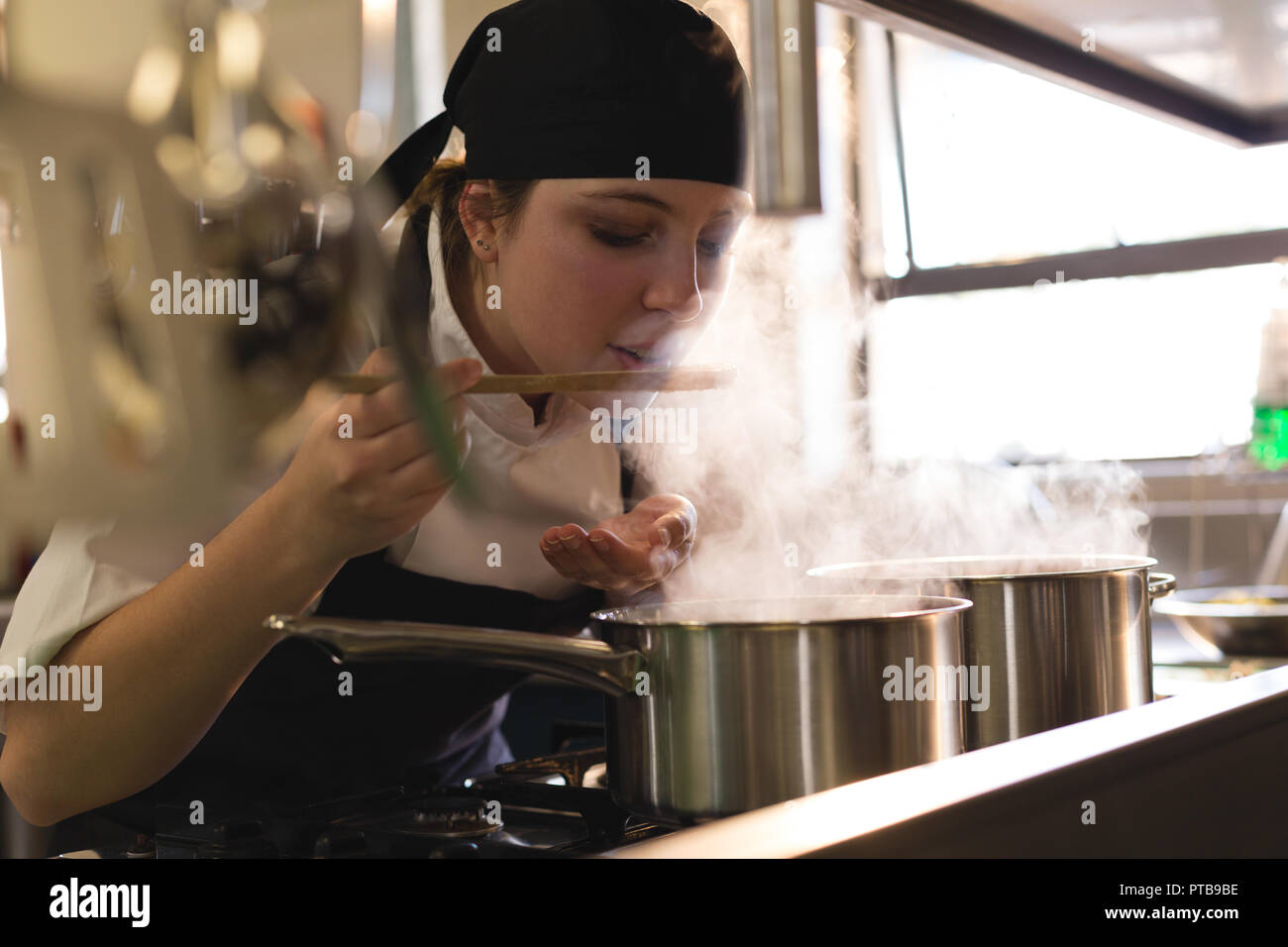 Female tasting food hi-res stock photography and images - Alamy