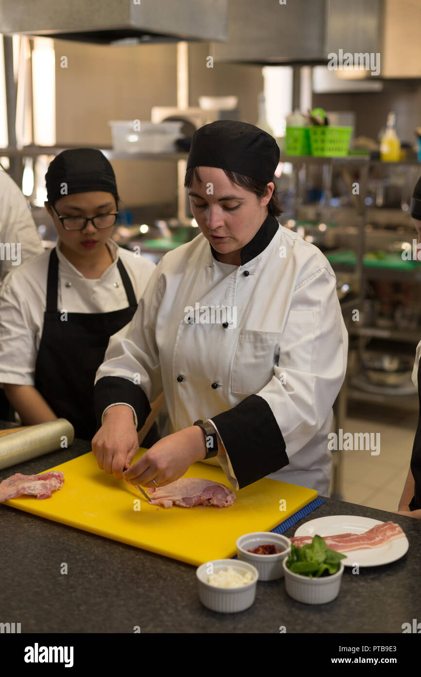 Cutting meat hi-res stock photography and images - Alamy