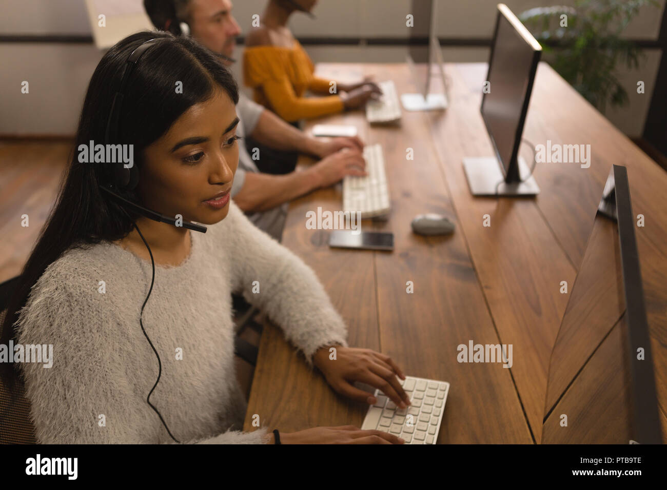 Female executive working in office Stock Photo - Alamy