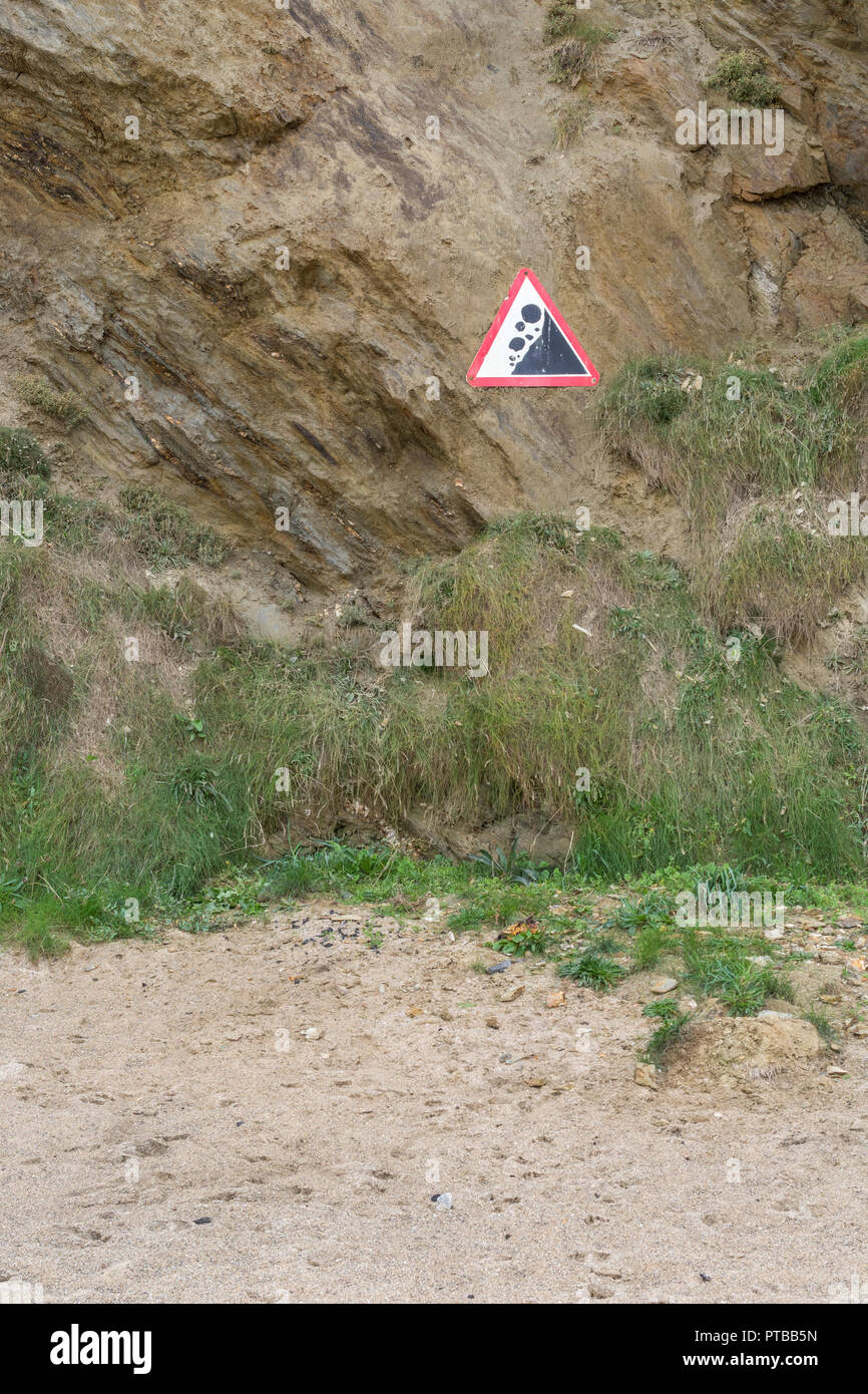 Dangerous cliffs / falling rocks warning sign at Newquay cliffs ...
