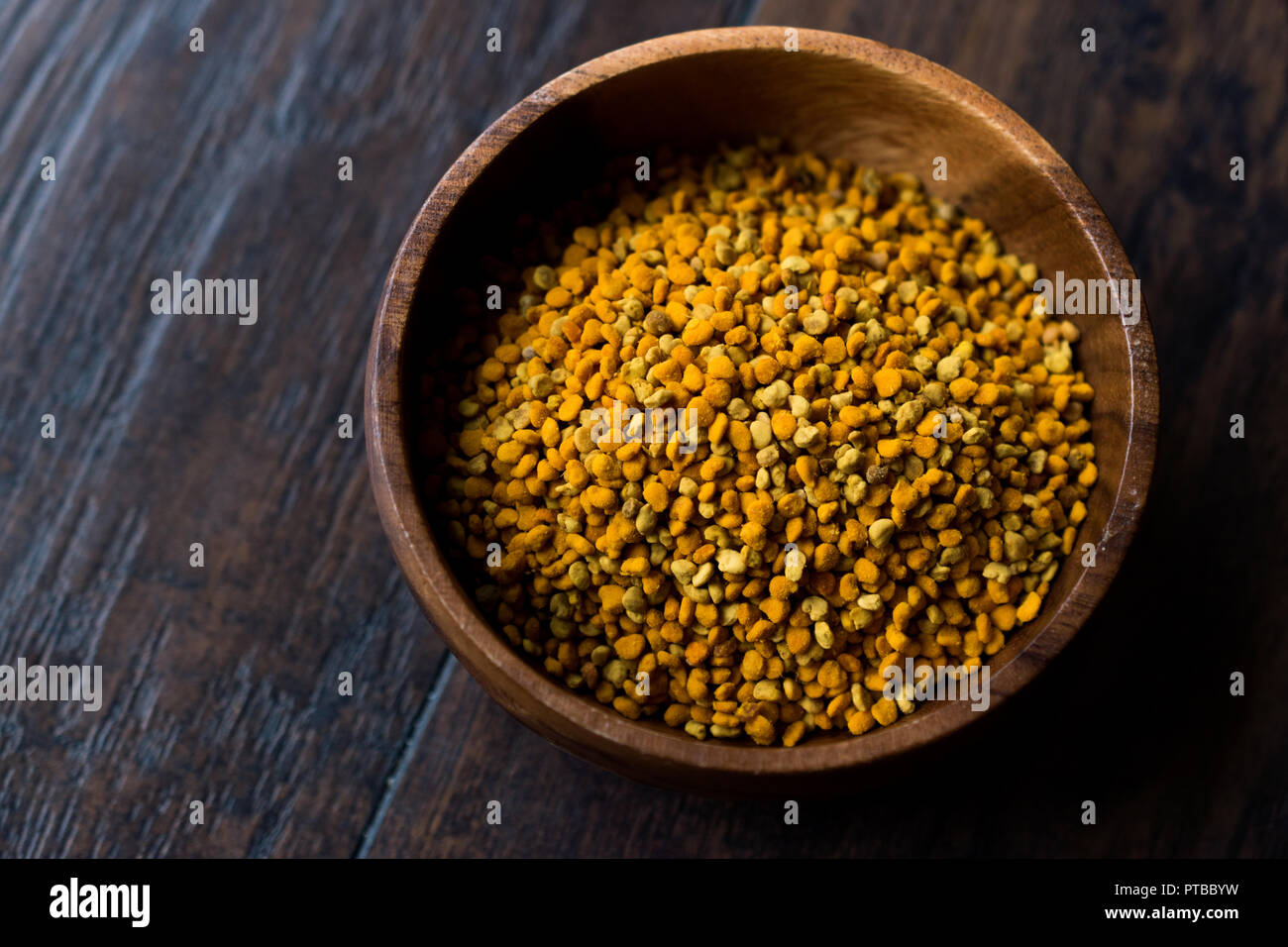 Bee Pollen Seeds in Wooden Bowl / Polen. Organic Product Stock Photo ...