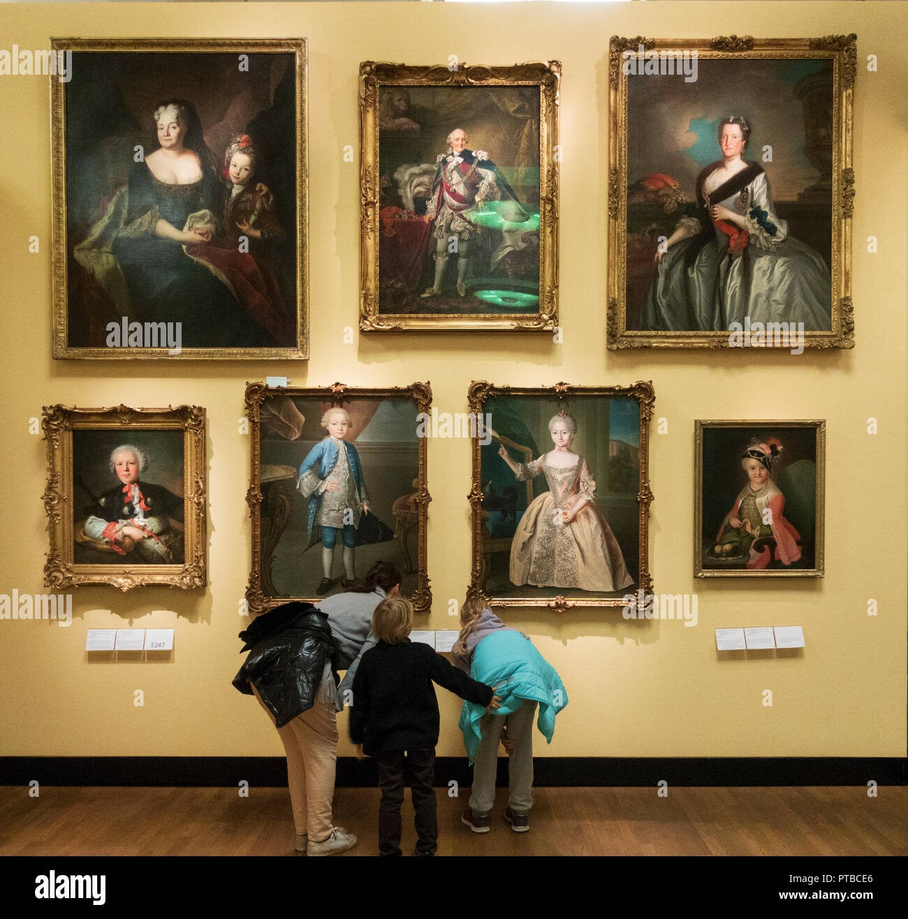 Visitors looking at old portrait paintings at the German History Museum ...