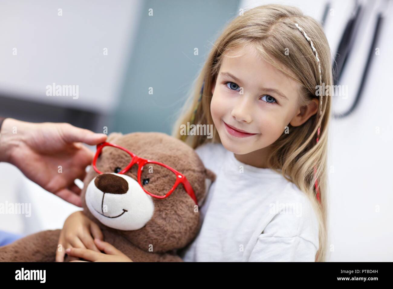Picture of child optometry male optometrist optician doctor examines ...