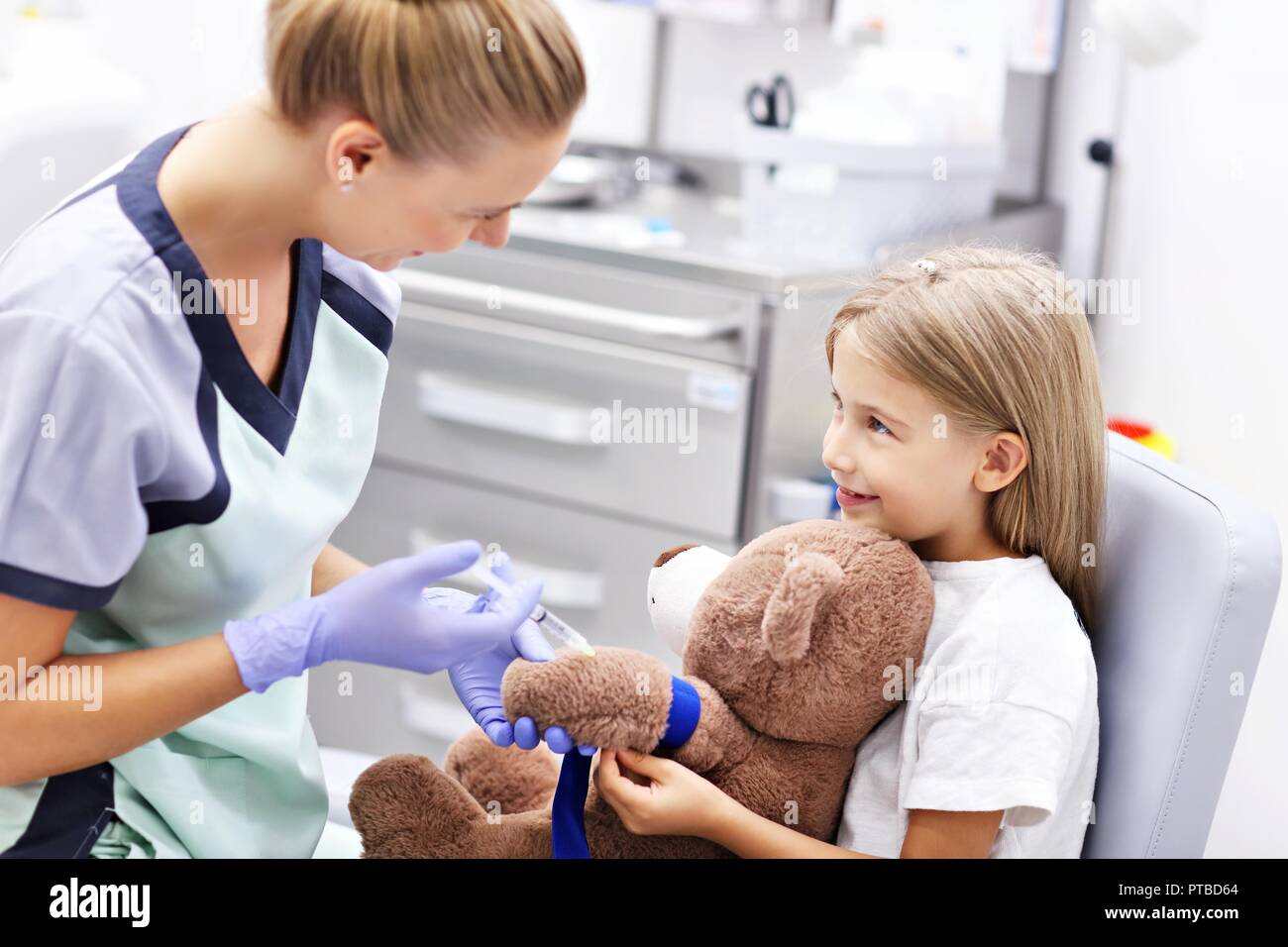 Picture of brave little girl having blood collection for tests Stock ...