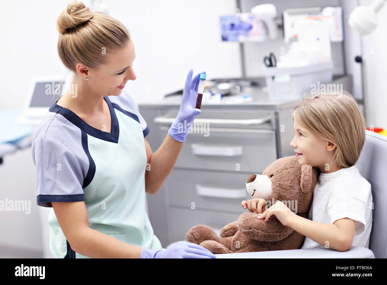 Picture of brave little girl having blood collection for tests Stock ...