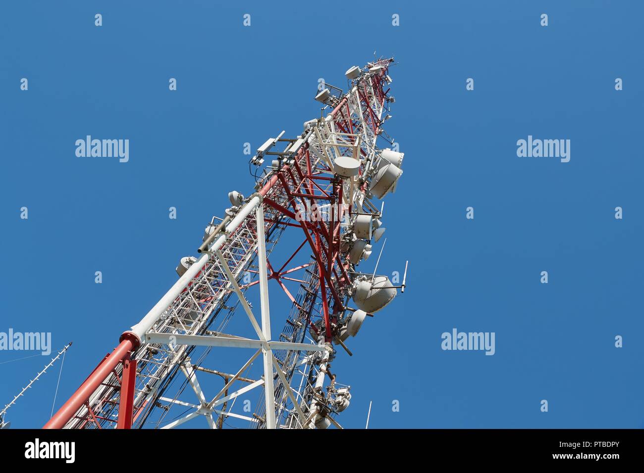 Transmitter towers, blue sky Stock Photo - Alamy