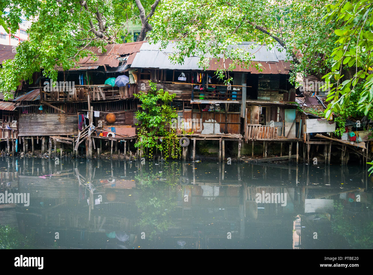 Residential houses above water canal in bangkok hi-res stock ...