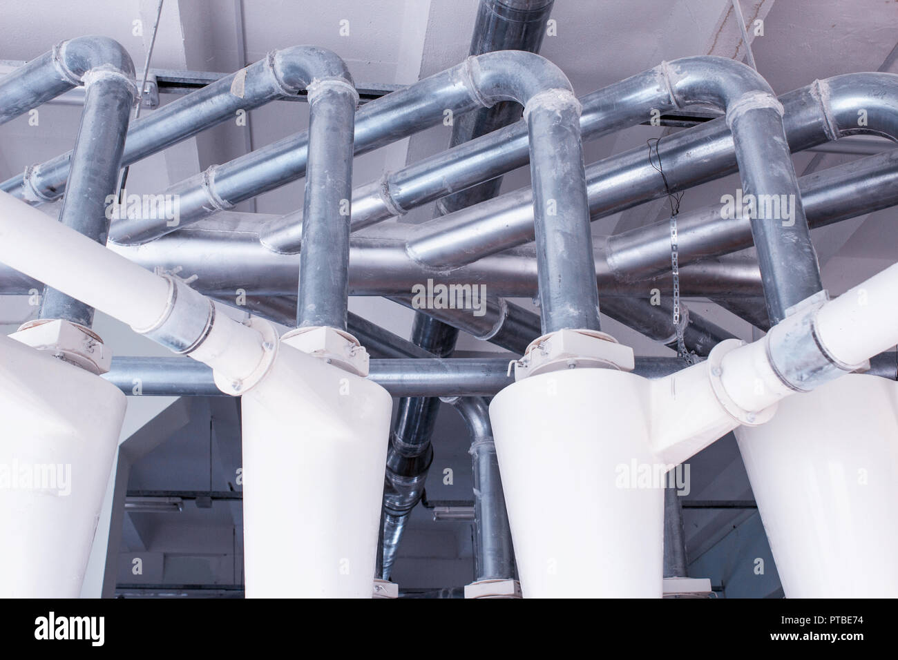 Plant for the production of food flour, a lot of metal pipes through ...